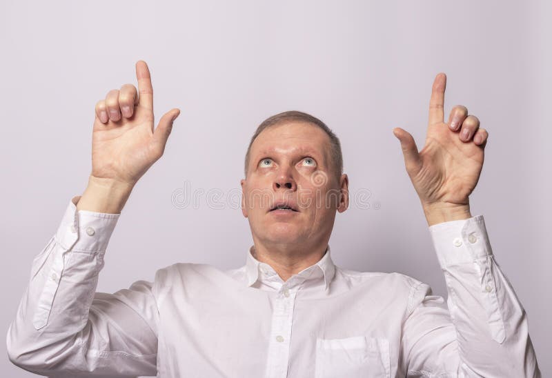 Adult Man Looking and Pointing Up with Both Fingers Stock Photo - Image ...