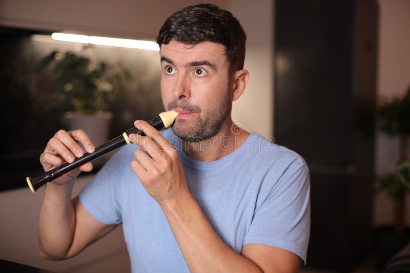 Adult Man Playing the Flute Stock Photo - Image of classroom, hold ...