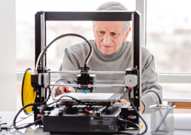Man with 3D printer stock image. Image of product, technology - 245150223