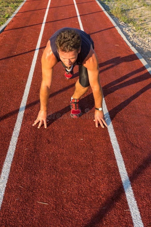 Adult Man is Preparing To Start on the Track Stock Photo - Image of ...