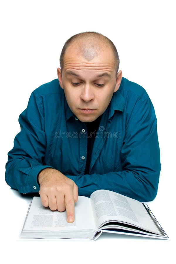 Man Intently Reading a Book Stock Photo - Image of young, book: 26914362