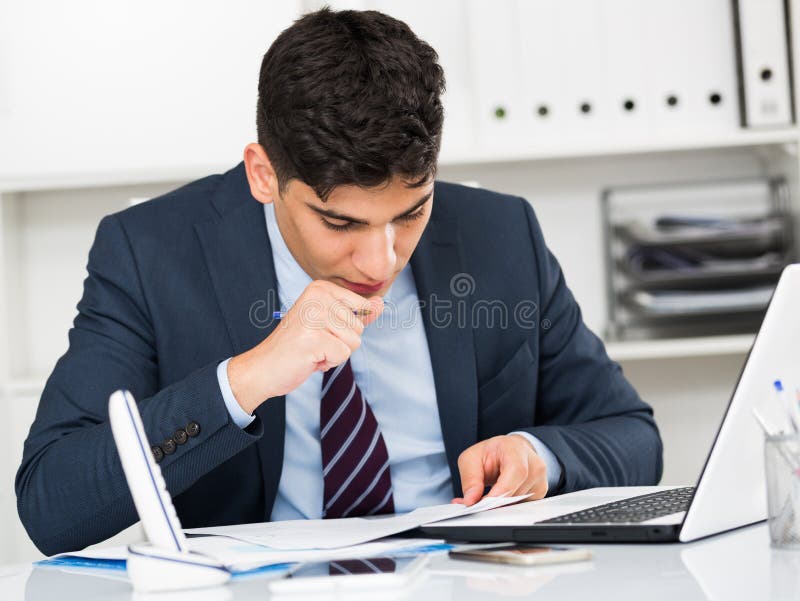 Adult Man is Reading Documents about the Transaction Stock Image ...