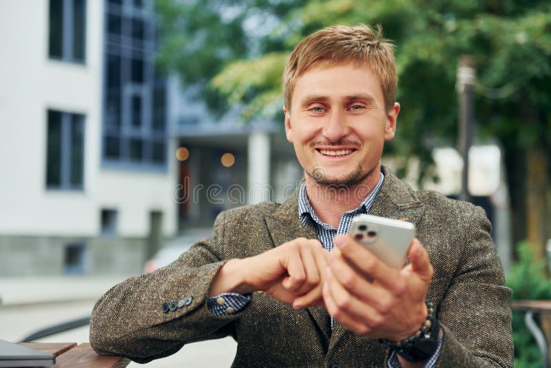 Adult Man Sitting Outdoors at the Cafe Table at Daytime Stock Photo ...