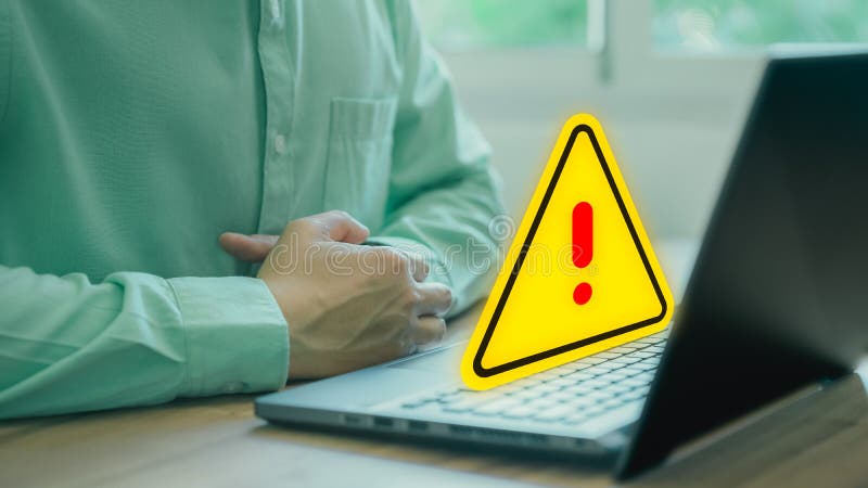 Adult Man Using Computer Laptop with Triangle Caution Warning Sign for ...