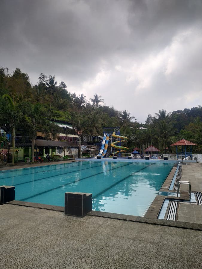 Adult pool with long slide stock image. Image of adult - 261950529