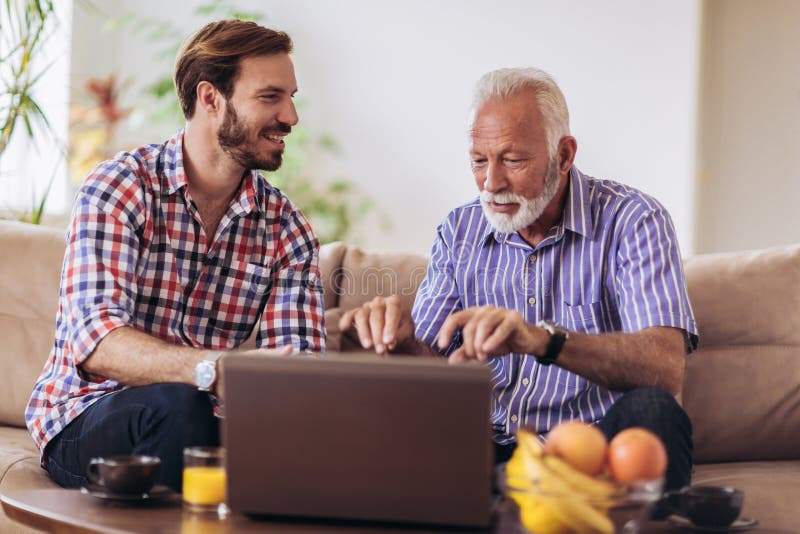 Adult Son Helping Senior Father with Computer Stock Image - Image of ...