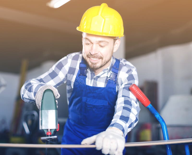 Adult is Using Power Jigsaw for Construction Work Stock Image - Image ...