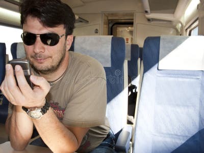 Adult Using Smartphone on Train Stock Image - Image of person, chatting ...