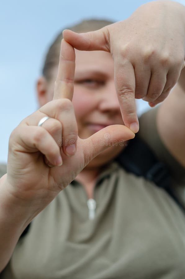 An Adult Woman Makes a Vertical Rectangular Frame Shape with Her Hands ...