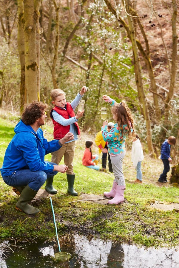 Adults and Children Exploring Pond at Activity Centre Stock Image ...