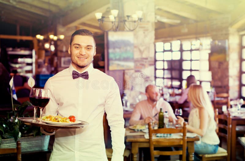 Portrait of Adults in Middle Class Restaurant and Happy Waiter Stock ...
