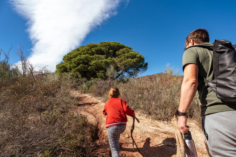 Adults Hiking in Nature: Exploring a Rugged Trail with Scenic Views ...