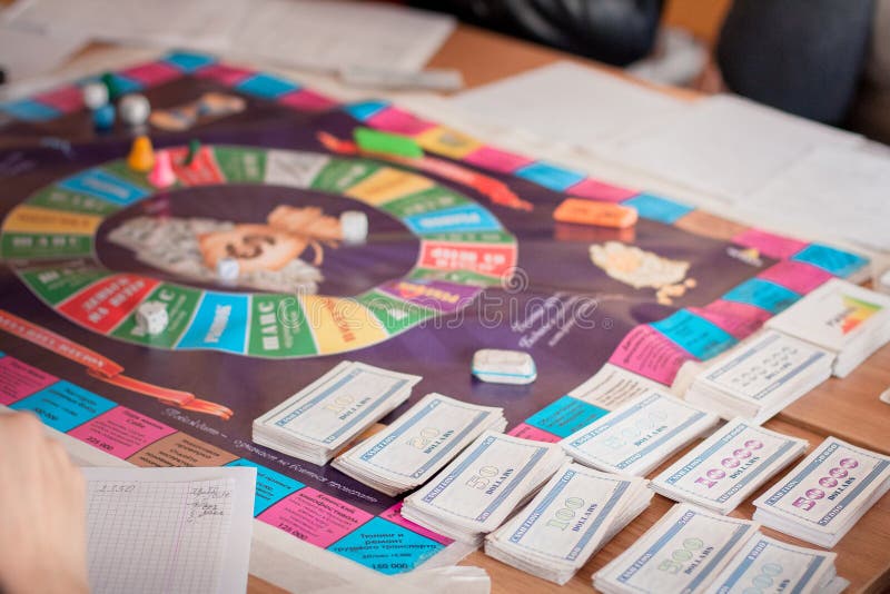 Adults playing cash flow stock photo. Image of agreement - 79258714