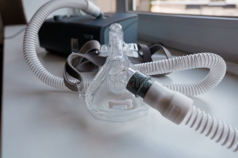 Advanced CPAP Machine with Attached Mask and Tubing on a Windowsill ...