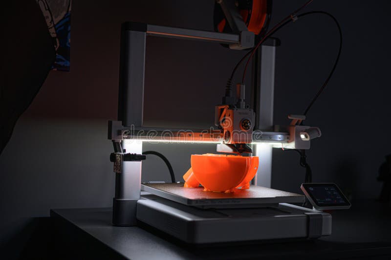 3D Printer Creating Orange Plastic Object on Platform Stock Image ...