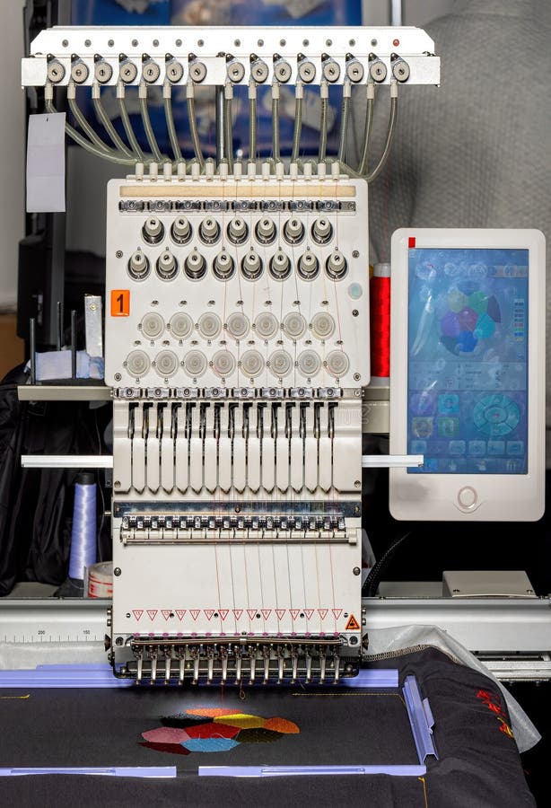 Intricate Embroidery Machine in Action Creating Colorful Designs in a ...