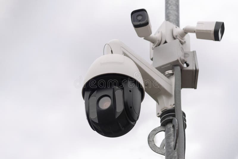 Advanced Security Camera System on Pole Against Cloudy Sky Stock Image ...