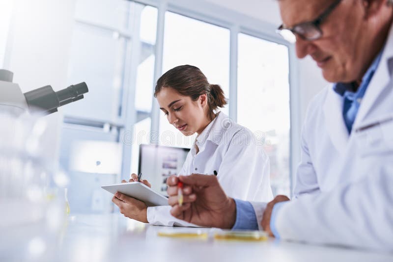 Advanced Technology To Help Advance the Sciences. Two Scientists Working in a Lab. Stock Photo ...