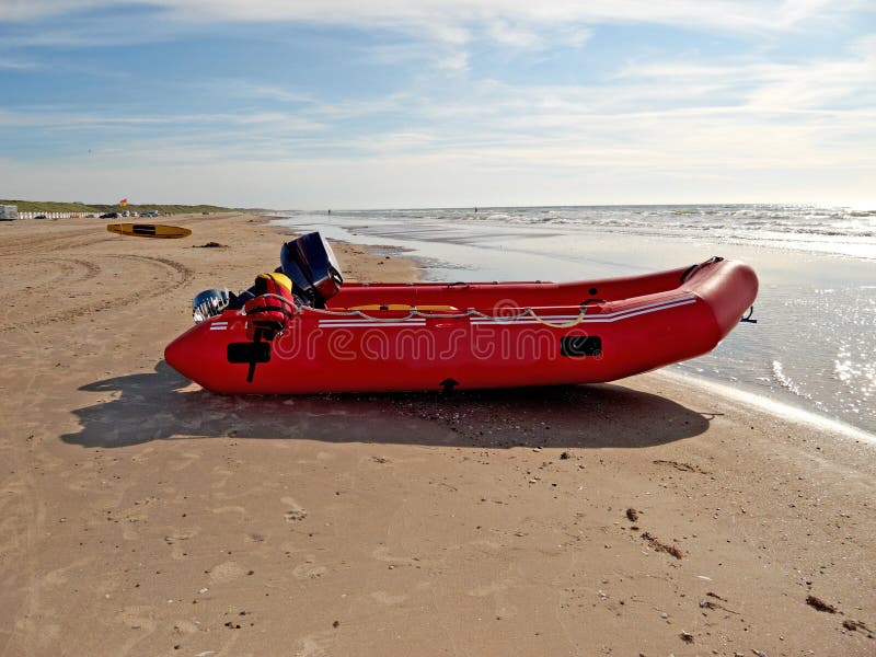 Adventure is Calling...a Red Dingy on the Beach on a Summers Day. Stock ...