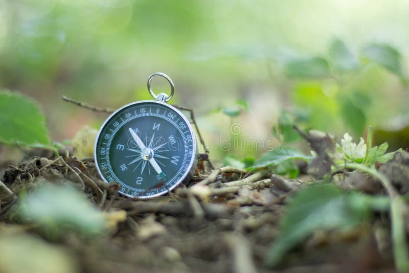 Adventure: Compass is Lying on the Floor, Showing the Direction Stock ...