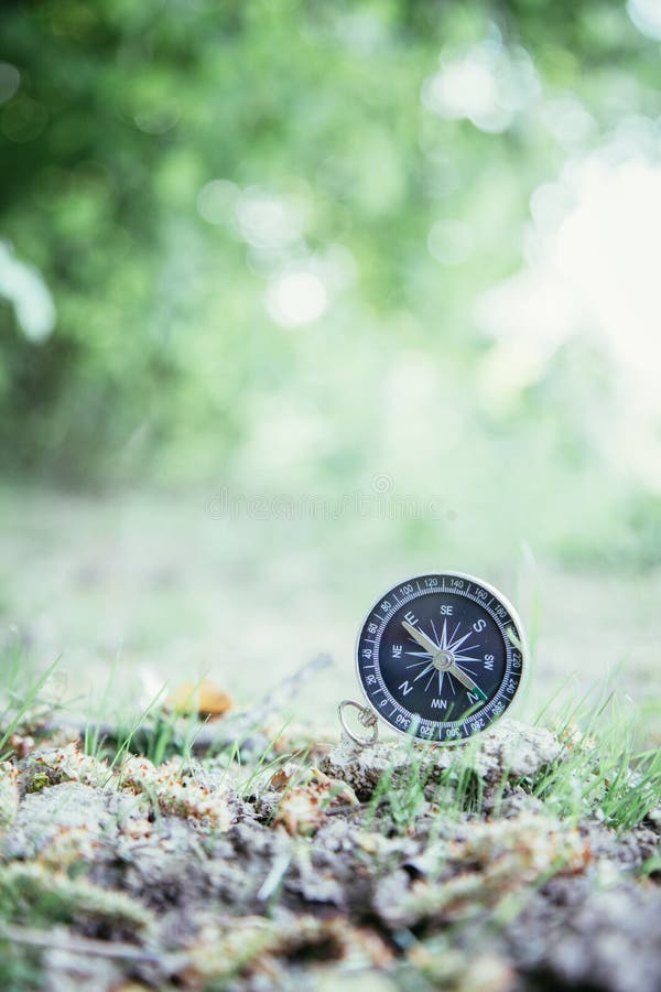 Adventure: Compass is Lying on the Floor, Showing the Direction Stock ...