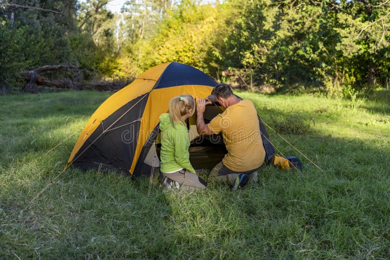 Adventure Couple Setting Up Tent in Serene Forest Stock Image - Image ...
