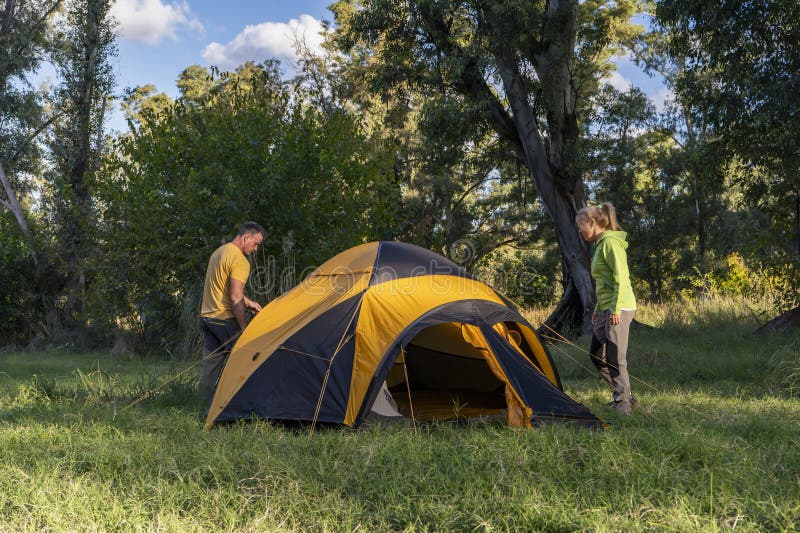 Adventure Couple Setting Up Tent in Serene Forest Stock Image - Image ...