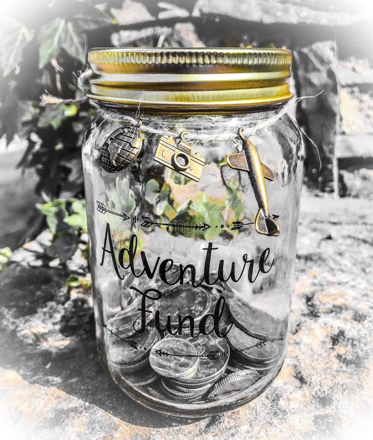 Adventure Fund Phrase Above Glass Jar with Money, Savings for Hobby ...