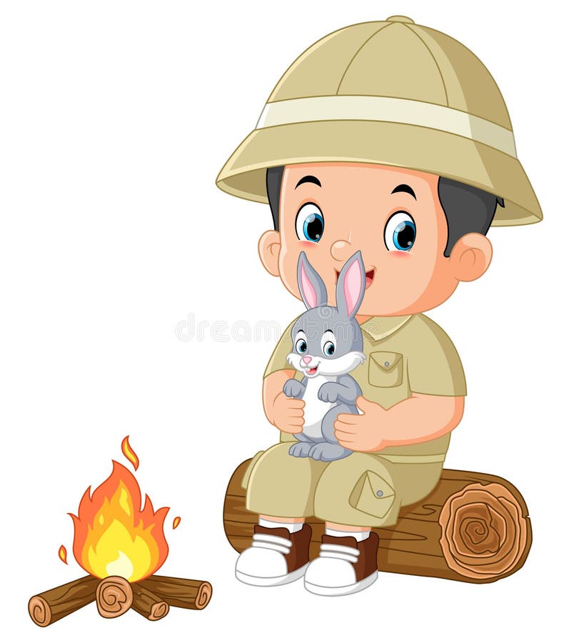 An Adventurous Boy Sits on a Fallen Tree and Holds a Rabbit while ...