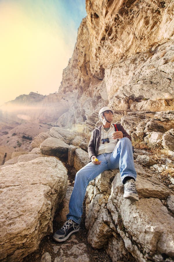 Adventurous Man with Helmet Having Some Rest on His Vacation Stock ...