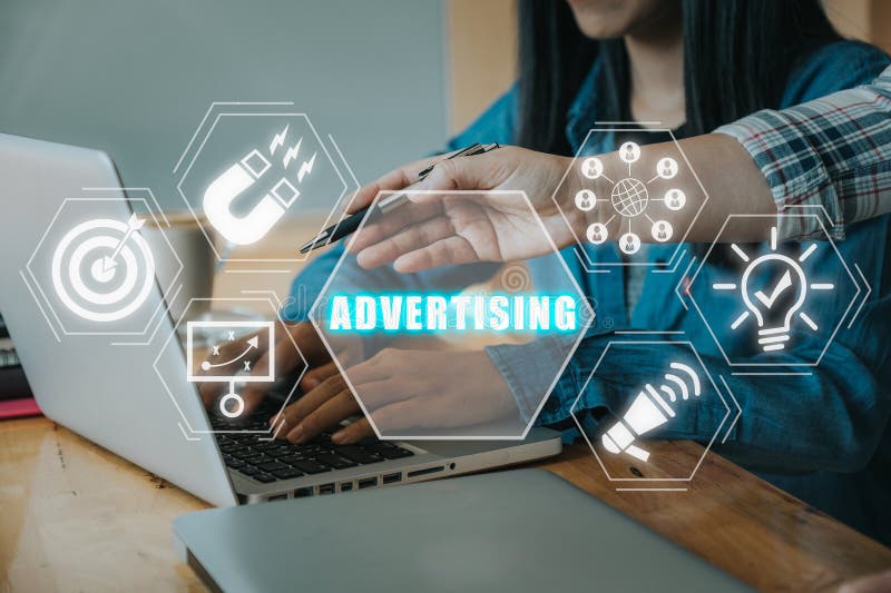 Businesss Team Working on Laptop Computer with Advertising Icon on ...