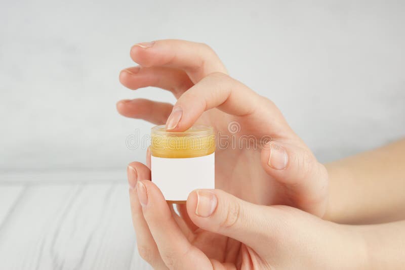 Advertising Cosmetic Women`s Hands Hold A Jar Of Cream And A Finger