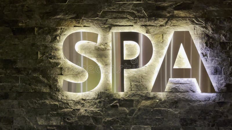 Advertising Sign Spa Area on a Black Brick Wall Stock Video - Video of ...
