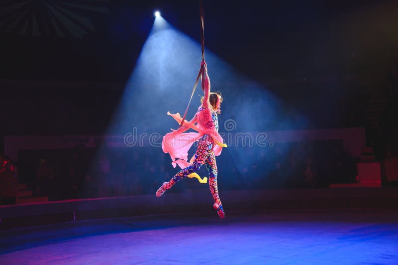 Aerial Acrobat in the Ring. a Young Girl Performs the Acrobatic ...
