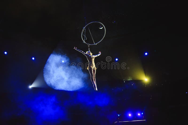 Aerial Acrobat in the Ring. a Young Girl Performs the Acrobatic ...