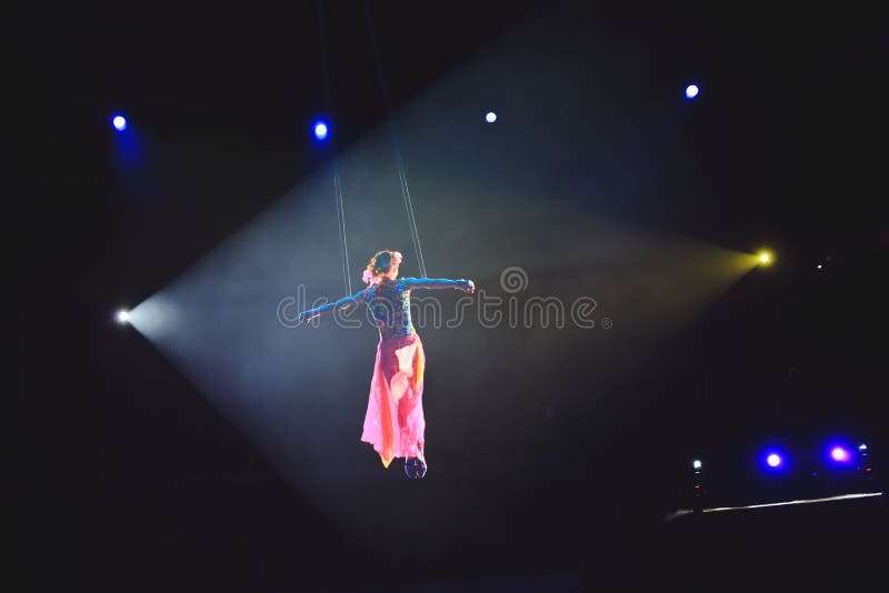 Aerial Acrobat in the Ring. a Young Girl Performs the Acrobatic ...