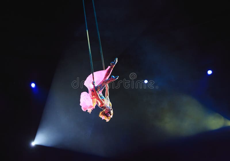Aerial Acrobat in the Ring. a Young Girl Performs the Acrobatic ...
