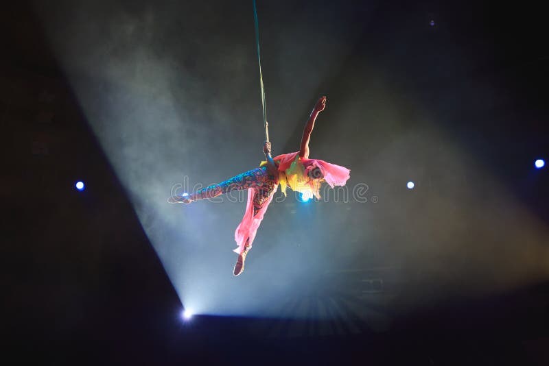 Aerial Acrobat in the Ring. a Young Girl Performs the Acrobatic ...