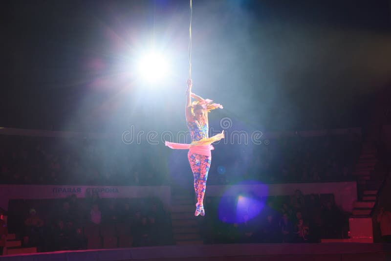 Aerial Acrobat in the Ring. a Young Girl Performs the Acrobatic ...