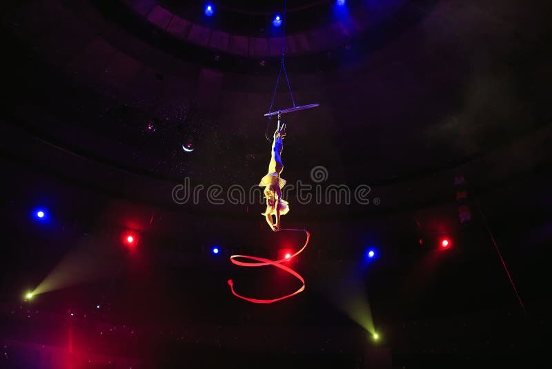 Aerial Acrobat in the Ring. a Young Girl Performs the Acrobatic ...