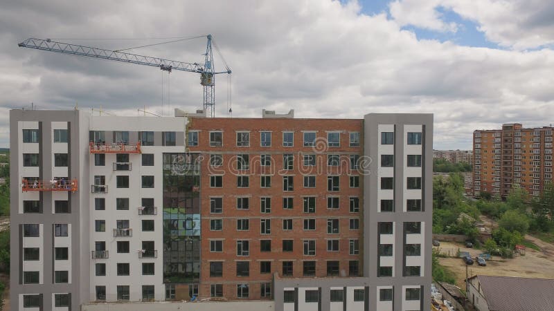 Aerial Building Process of Construction Site. Engineers Crane and City ...
