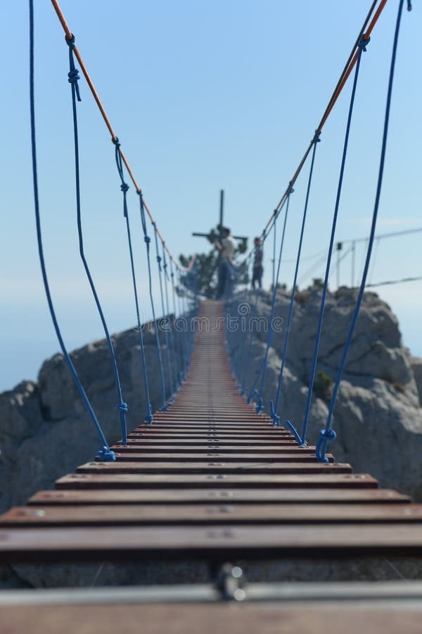An Aerial Cable-stayed Bridge Hanging Over an Invisible Chasm, with an ...