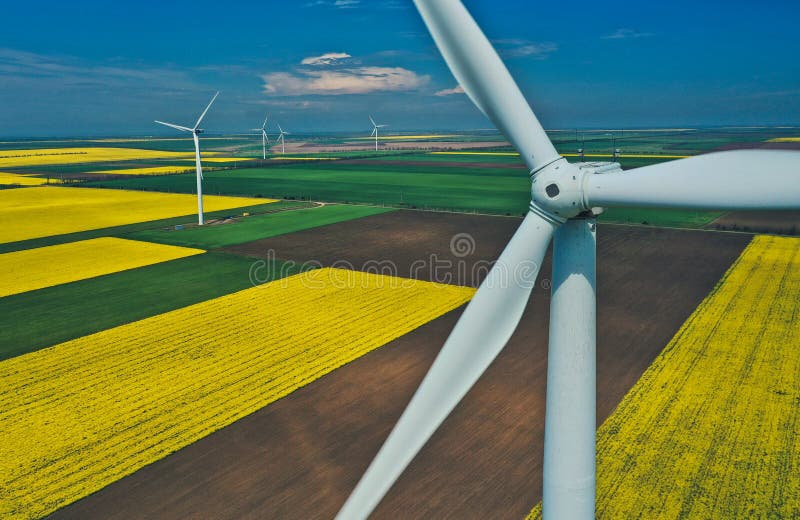 Aerial Close-up Shot of a Windmill that Rotates Under the Influence of ...
