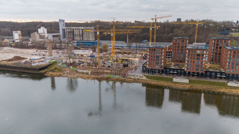 Aerial Construction Site by River with Cranes and Buildings. Editorial ...