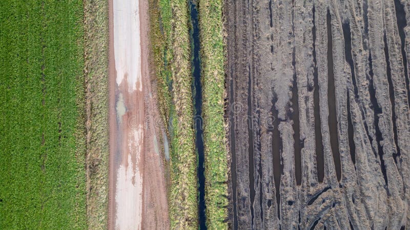 Aerial Contrast: Verdant Fields beside Plowed Soil Stock Photo - Image ...