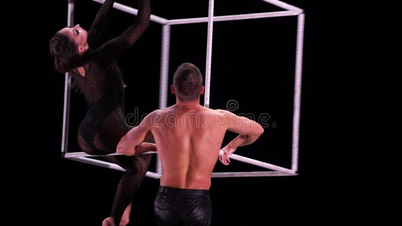 Aerial Cube Duo on Black Background Doing Performance. Concept of Romantic Relationship in ...