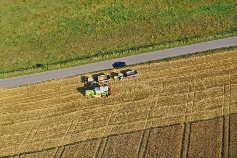 Aerial Drone Top Down View on Harvester Unloading Seed To Tractor ...