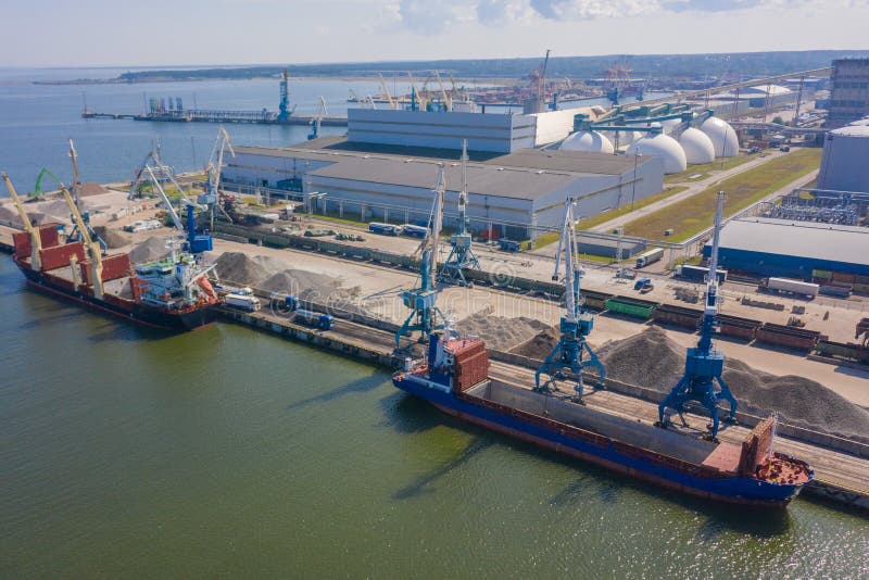 Loading and Unloading of Vessels on Industrial Terminal Stock Photo ...