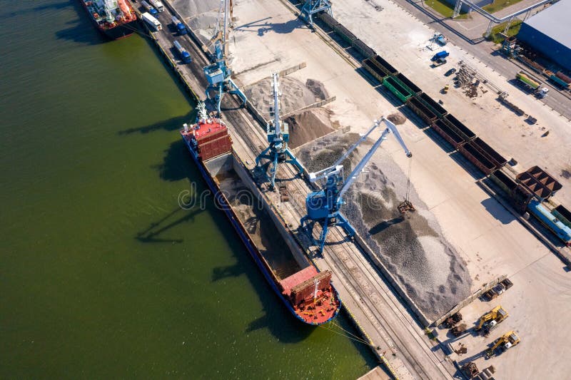 Loading and Unloading of Vessels on Industrial Terminal Stock Image ...
