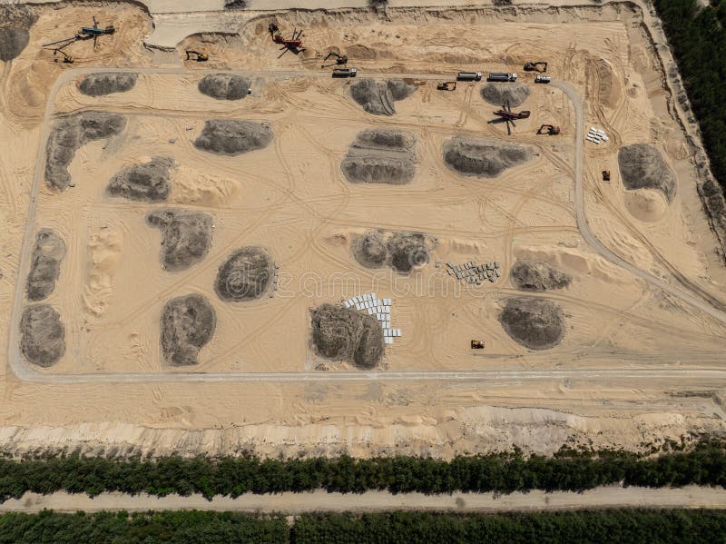Aerial Drone View of a Sand Mine in the Forest. Loader Loading Sand ...